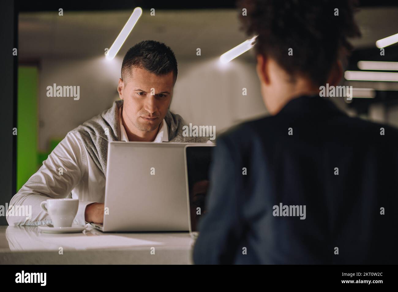 Office colleagues working opposite hi-res stock photography and images ...