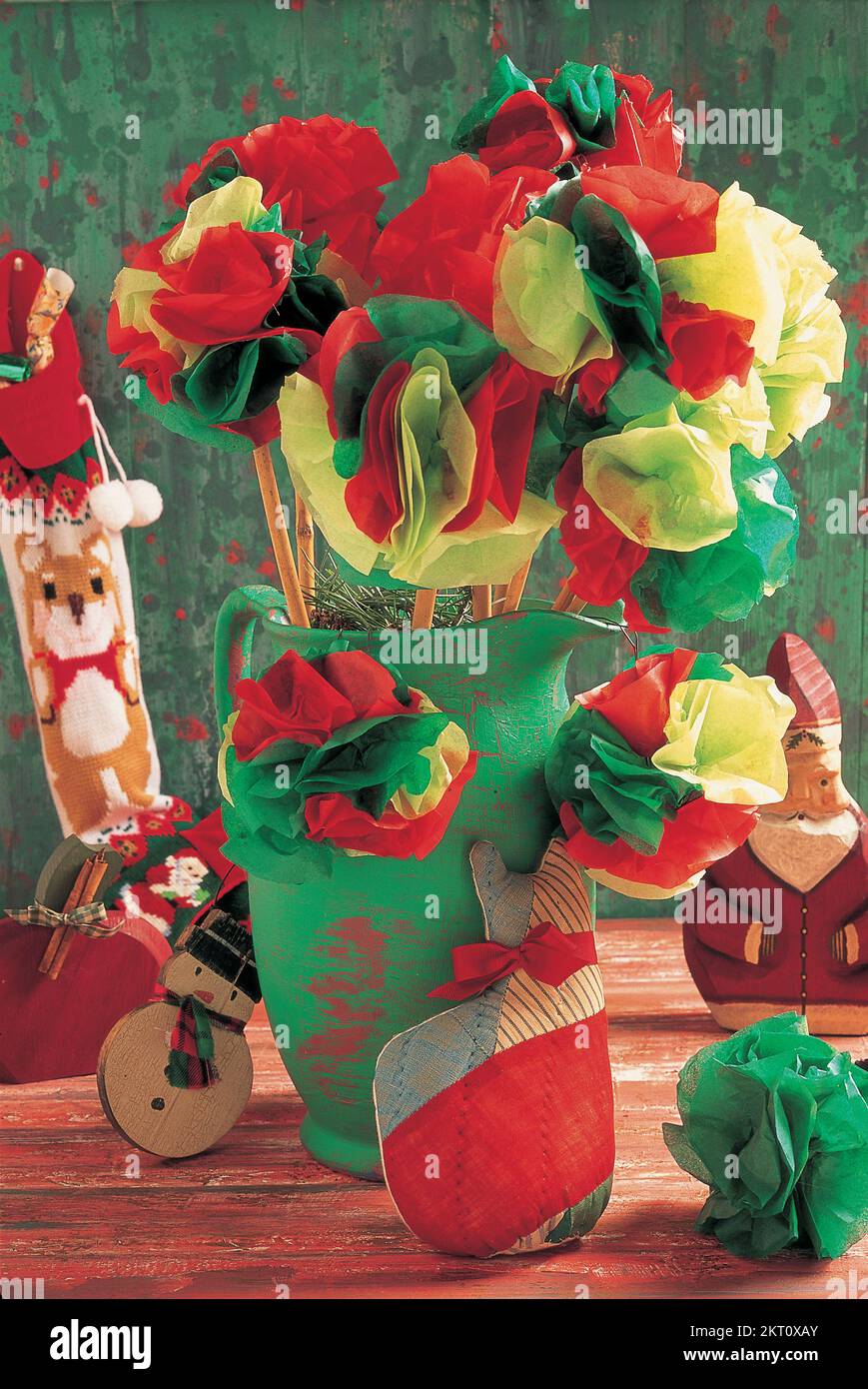 Paper Flowers in a green jug on table top Stock Photo - Alamy