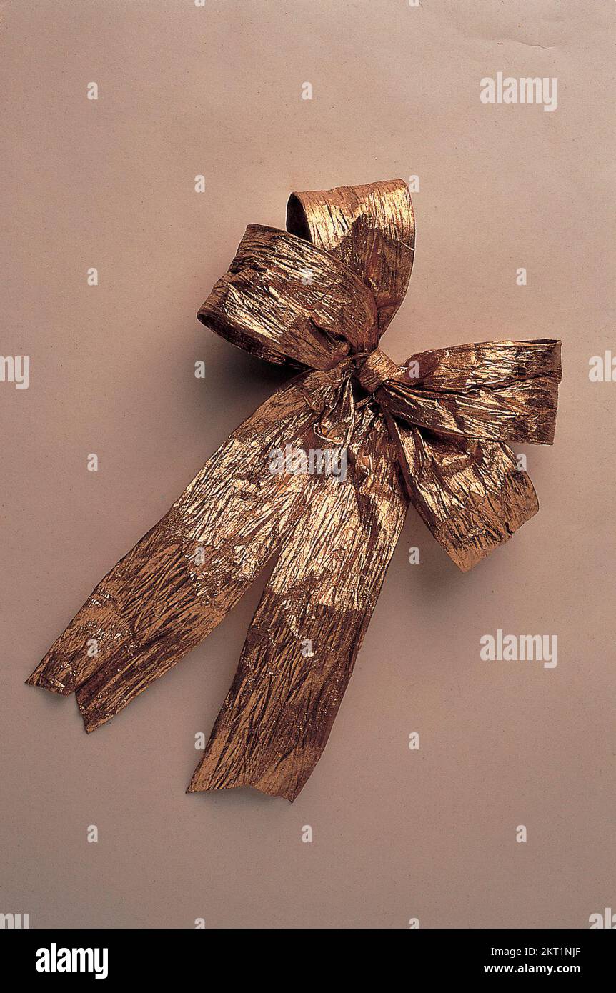 A gold bow Stock Photo - Alamy