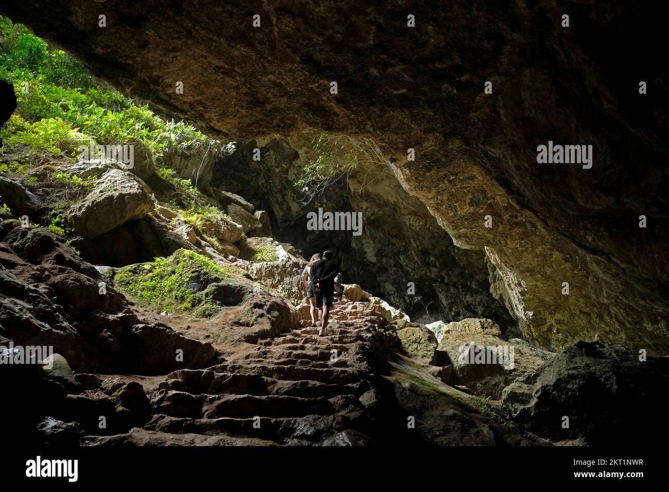 Hikers enter Lumiang Burial Cave located in Sagada in the Cordillera Mountains in Luzon Island ...