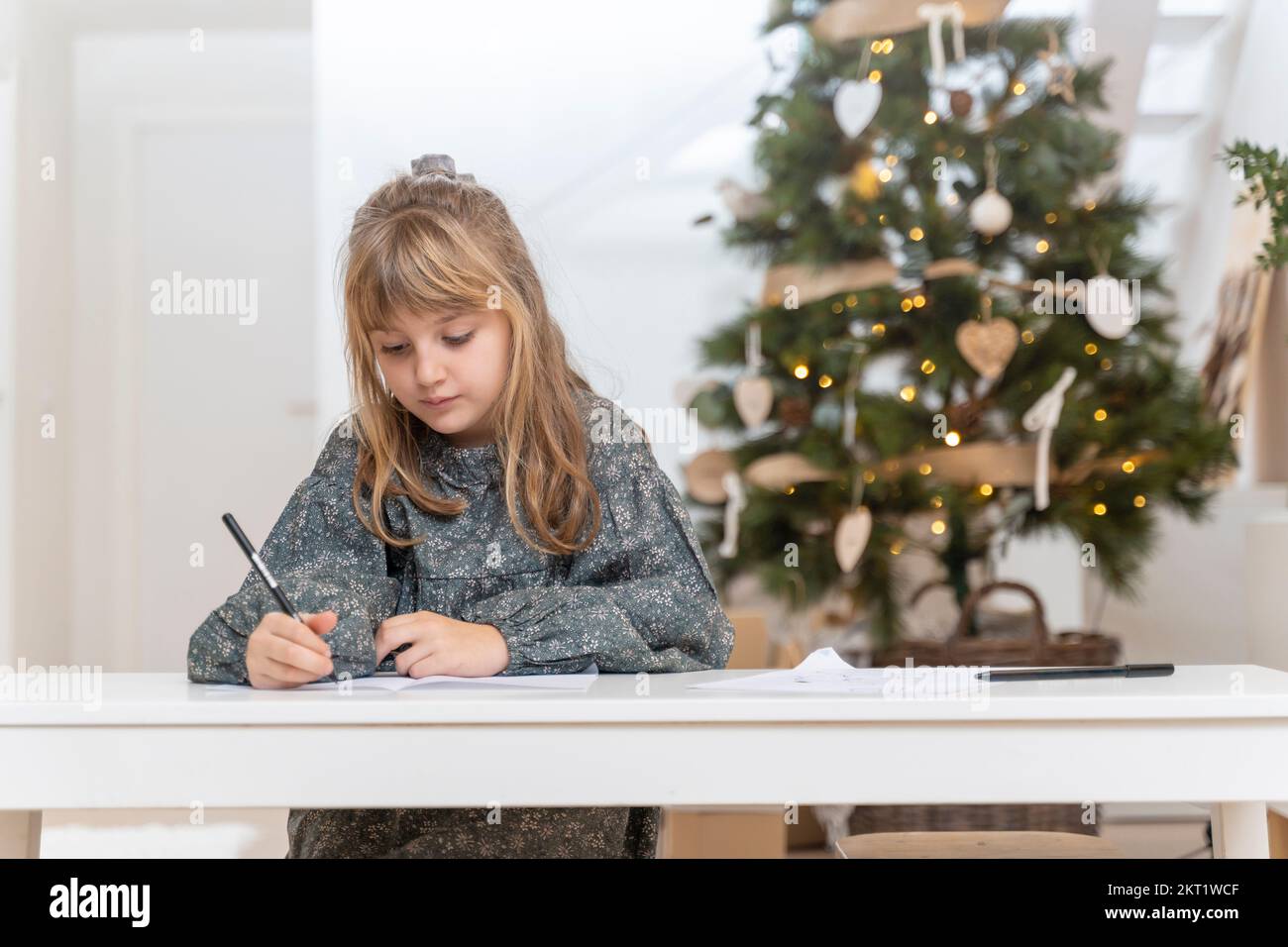 Little girl writing a letter to Santa Claus or the three wise men Stock ...