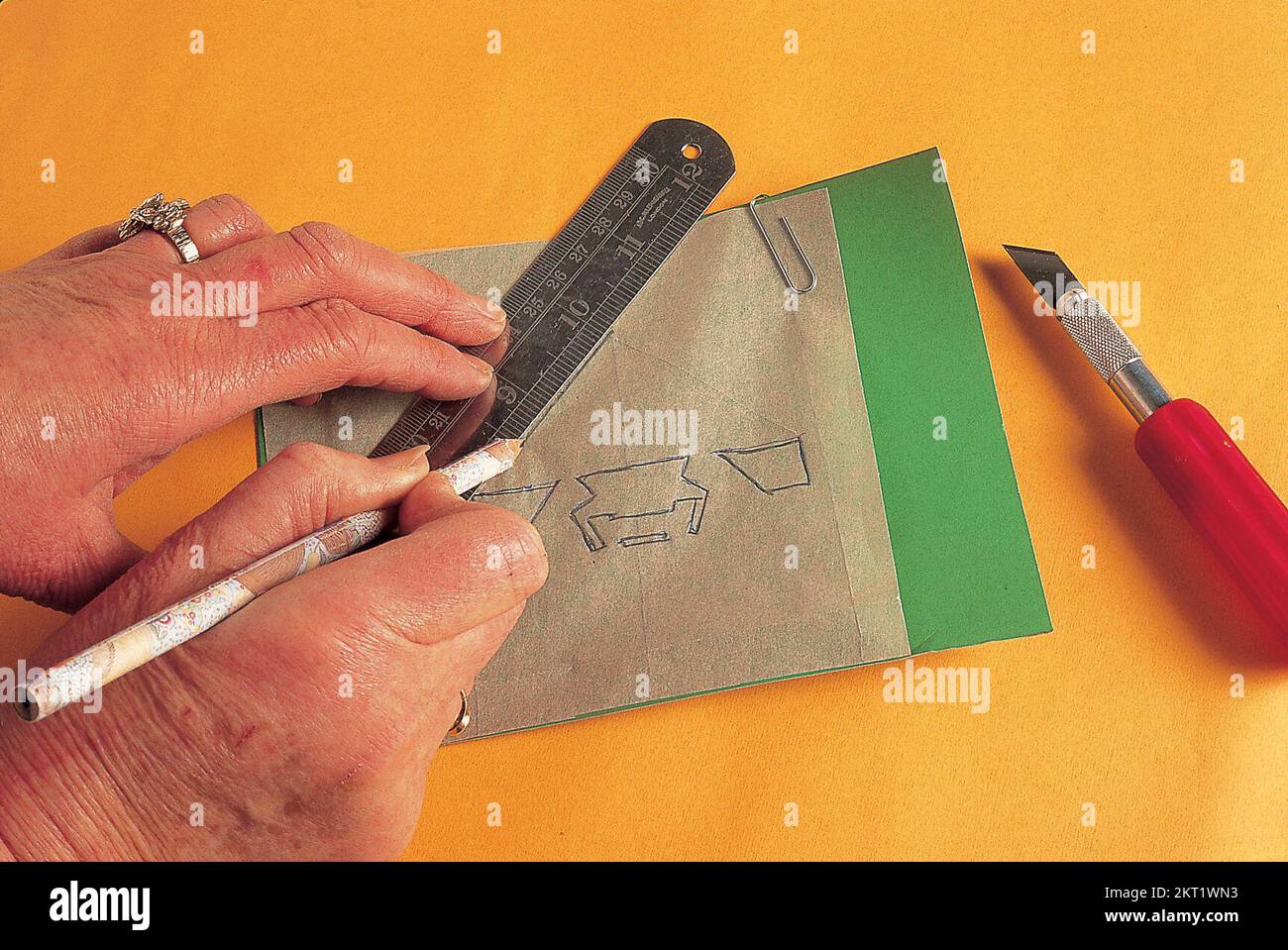 Drawing over the traced outline onto card Stock Photo - Alamy