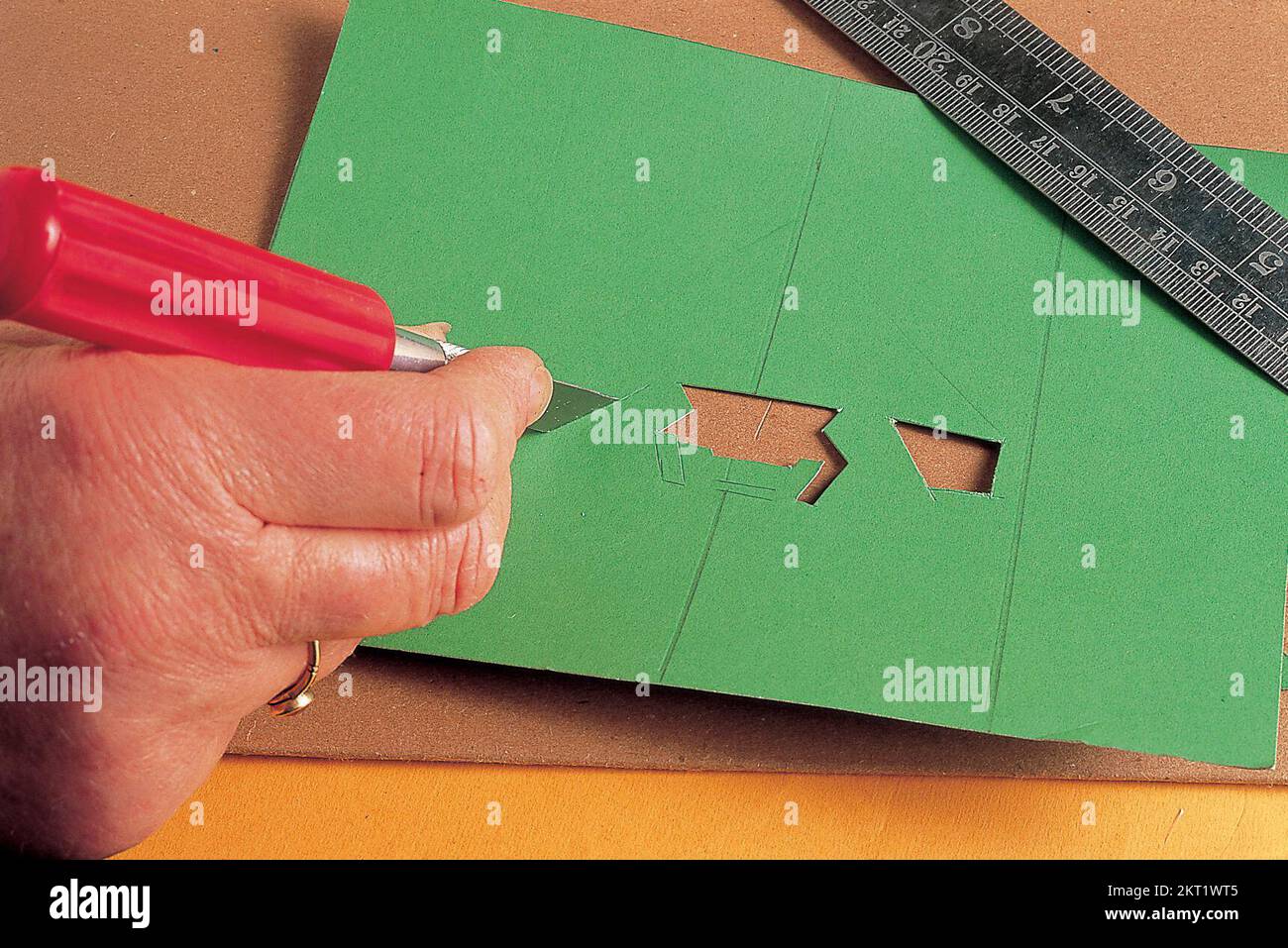 Cutting the shapes out with a knife Stock Photo - Alamy