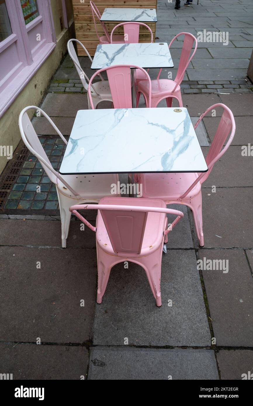 Pink table and chairs outside a restaurant in Bath (nov22 Stock Photo ...