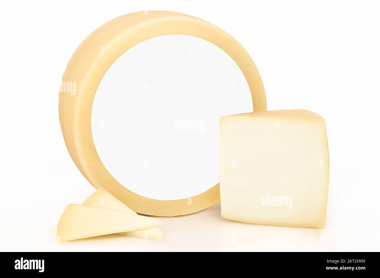 Textured cheese with a blank label next to a wedge and some slices ...