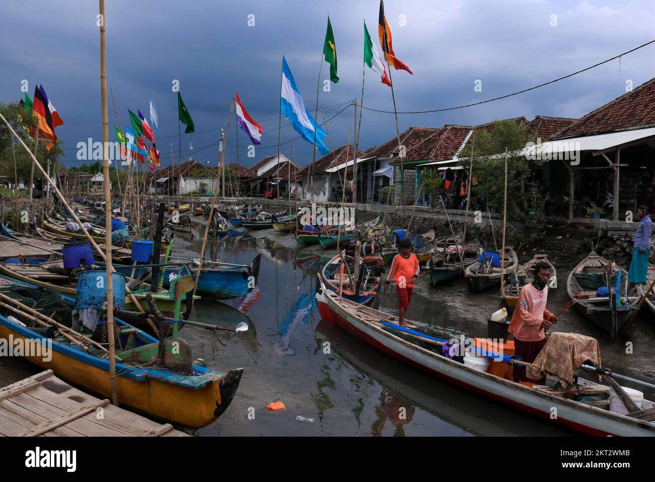 Pasuruan, East Java, Indonesia. 29th Nov, 2022. Fishermen lean their ...