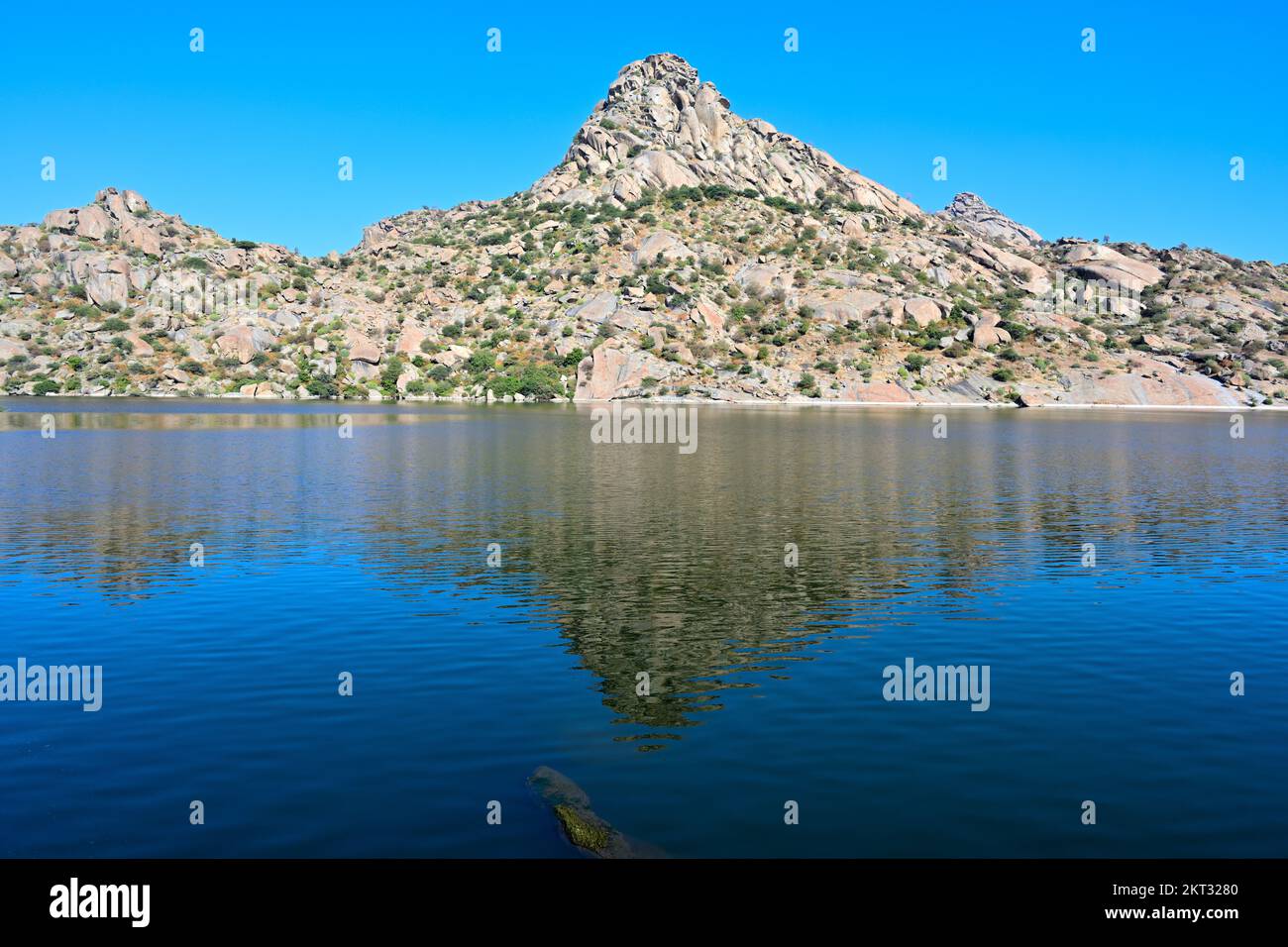 Jawai Bandh | Triangular shaped rocks on the lake shore Stock Photo - Alamy