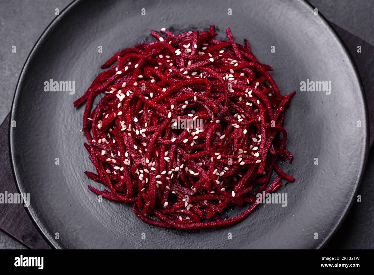 Tasty spicy Korean beet with spices and herbs on a dark concrete ...