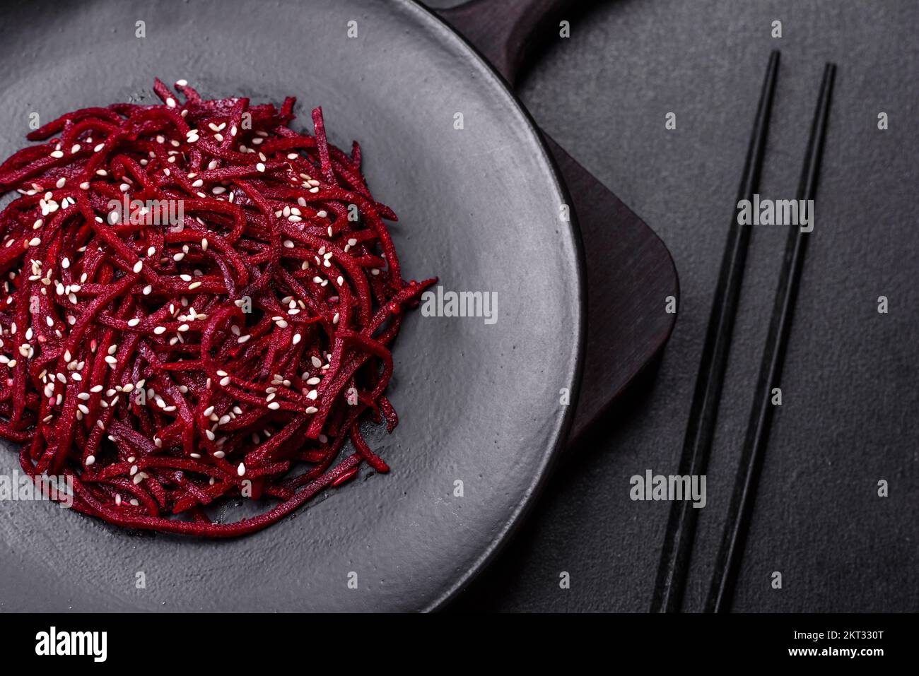 Tasty spicy Korean beet with spices and herbs on a dark concrete ...