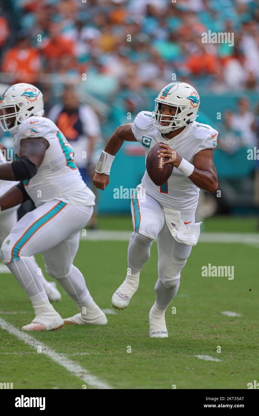 Miami. FL USA; Miami Dolphins quarterback Tua Tagovailoa (1) runs with ...