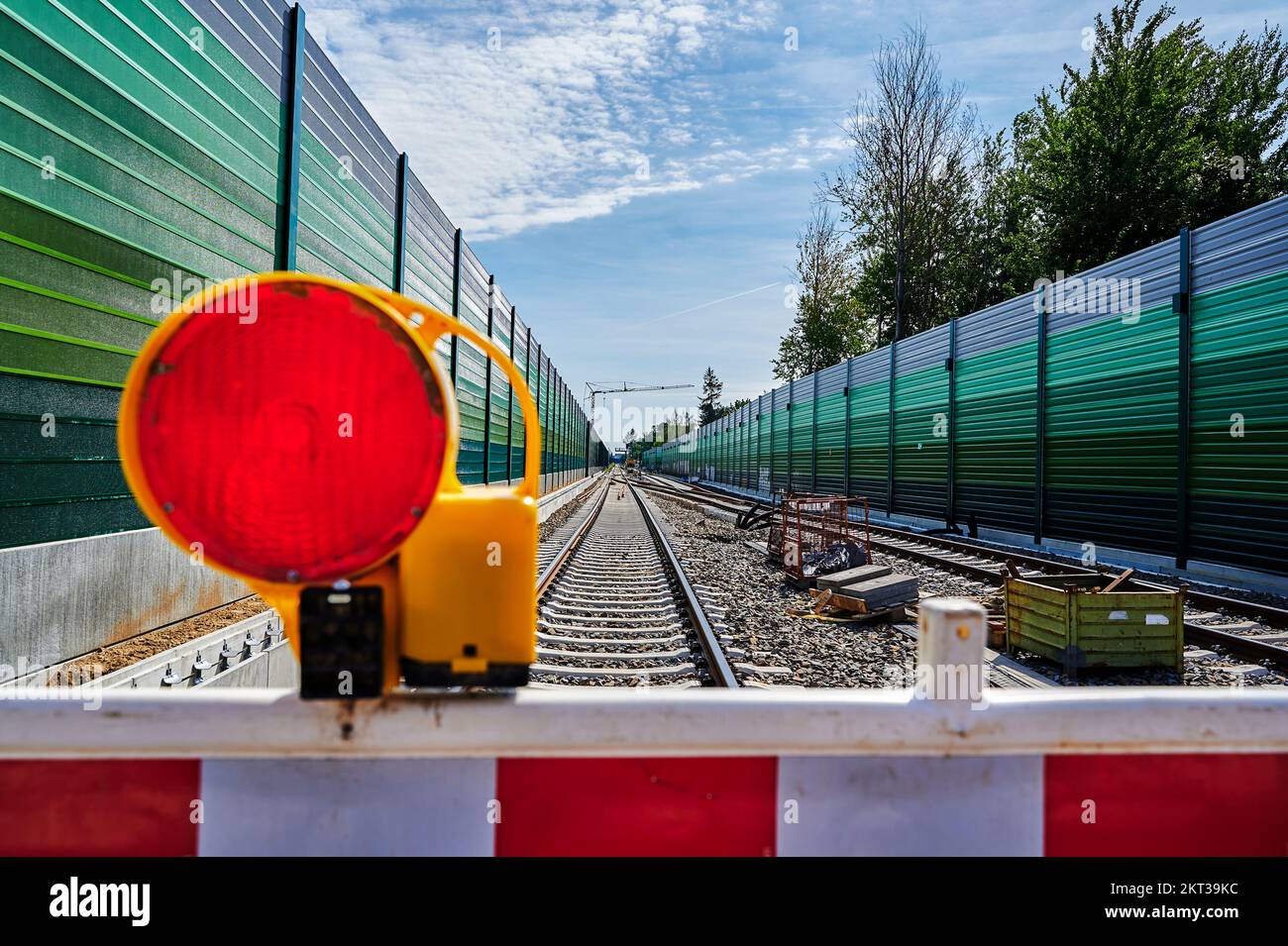 Warning light on a barrier in front of the construction site for a new ...