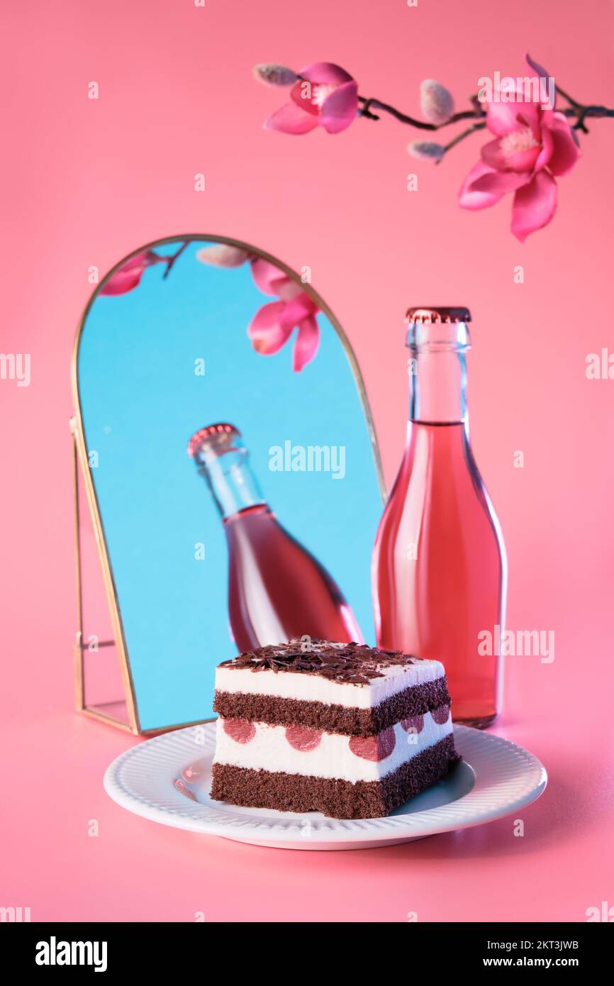Chocolate cake with sour cherries. Piece of cake on a plate with fork ...