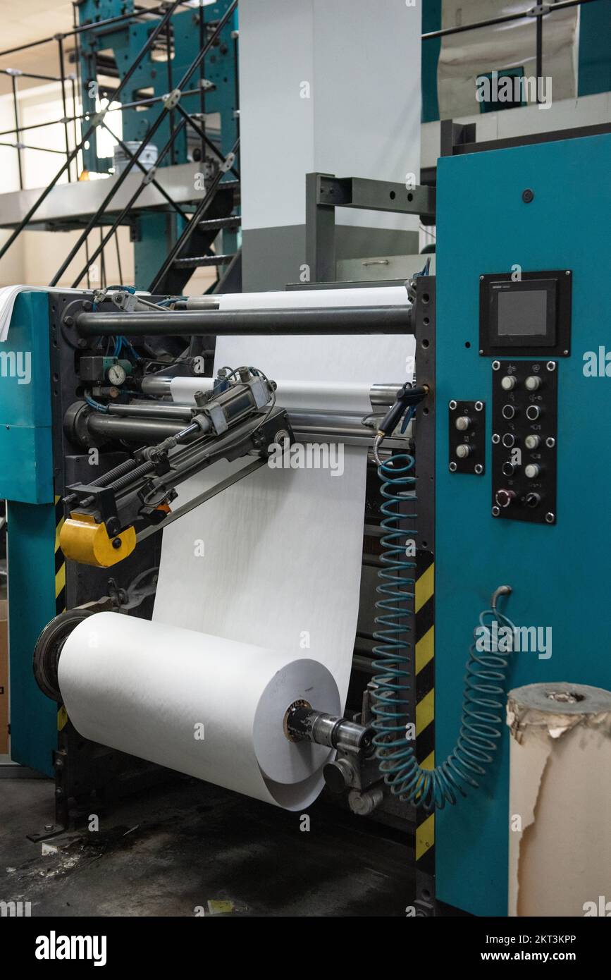 Printing house warehouse interior with printing machine Stock Photo - Alamy