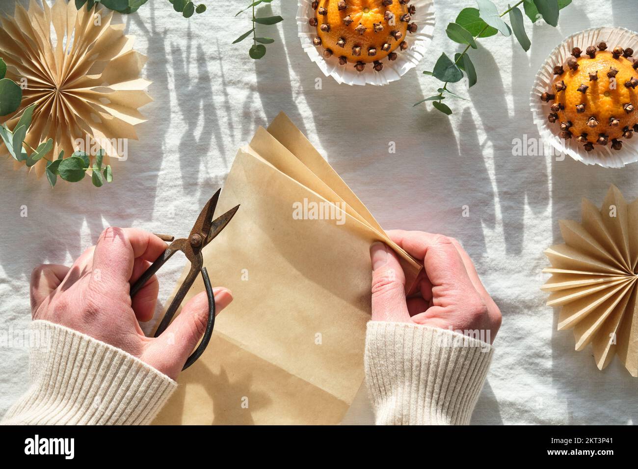 Fragrant pomander balls handmade from tangerines and cloves. Flat lay ...