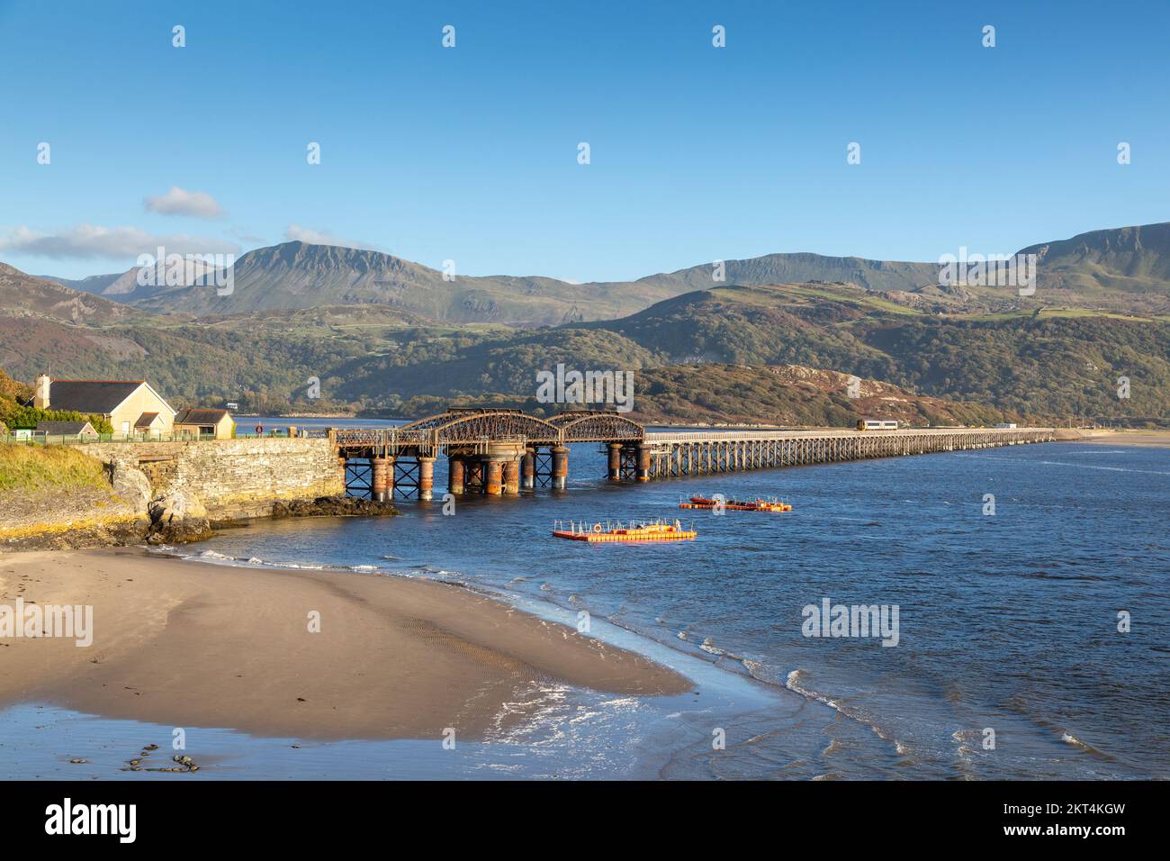 Cadair Idris mountain and the railway bridge seen from Barmouth, North ...