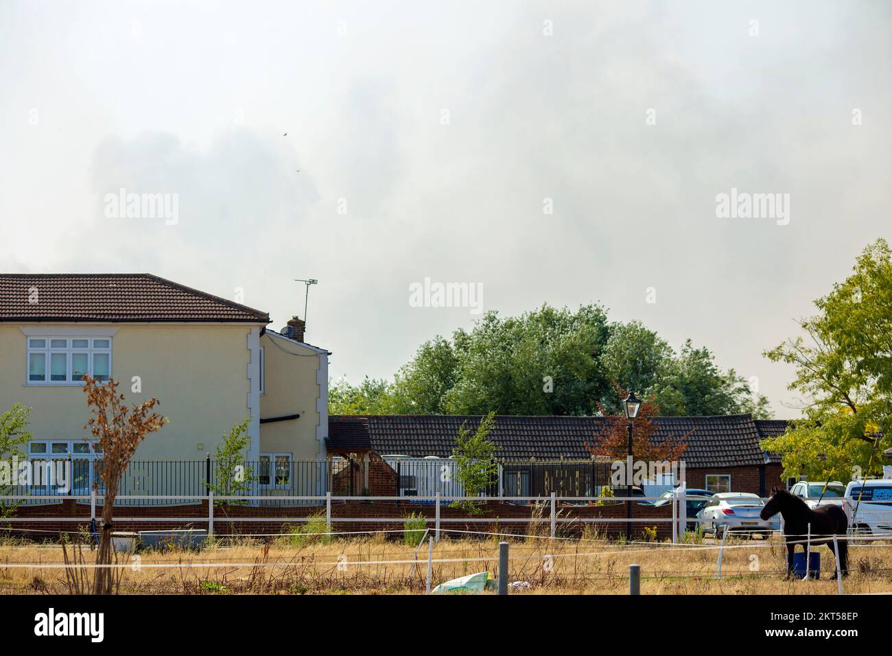 Smoke from a fire is seen in Wennington, east London, as the UK has ...