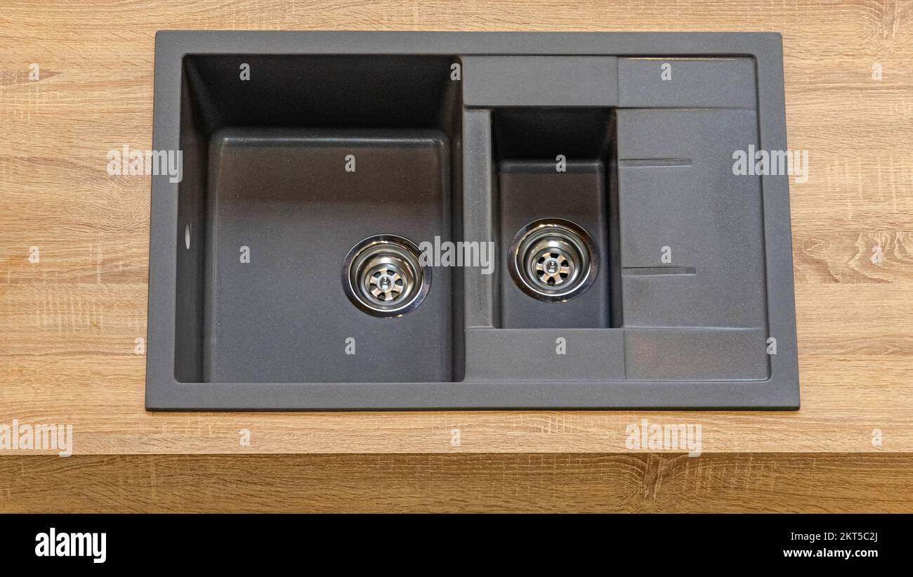 Rectangular Ceramic Black Kitchen Sink in Modern Home Stock Photo - Alamy