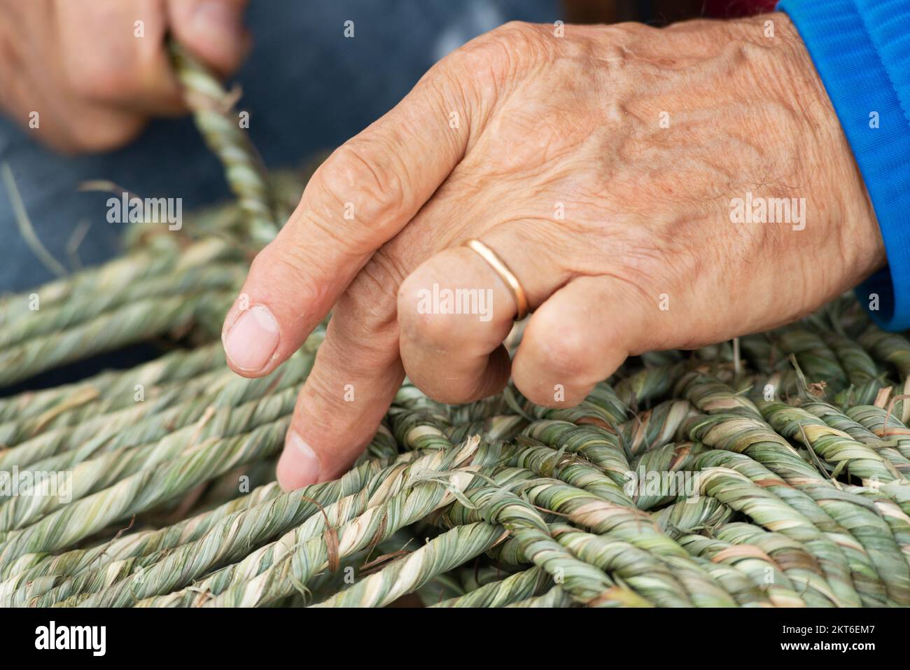 Italy, Lombardy, Chair-Mender bottoming a Chair With a Straw Stock ...