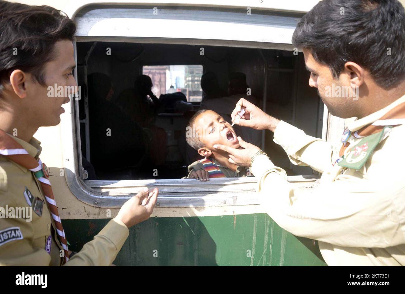 Health worker administrates polio-vaccine drops to a child during anti ...