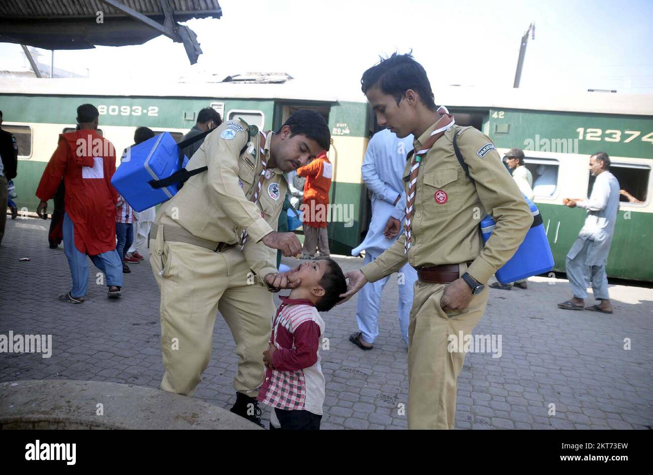 Health worker administrates polio-vaccine drops to a child during anti ...
