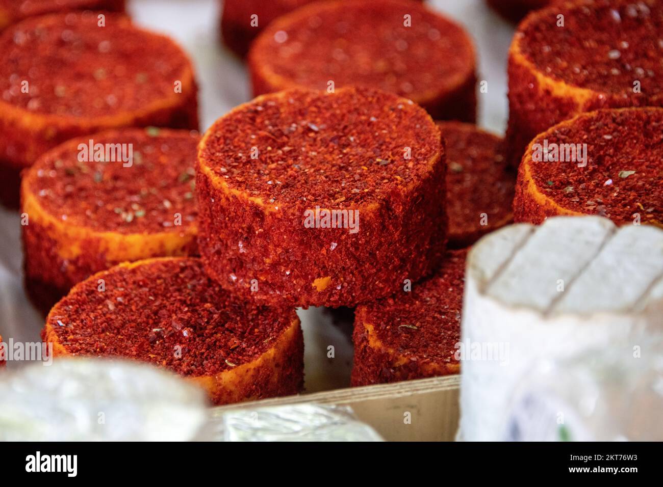 Near view of italian spicy cheese with paprika in a cheese public ...