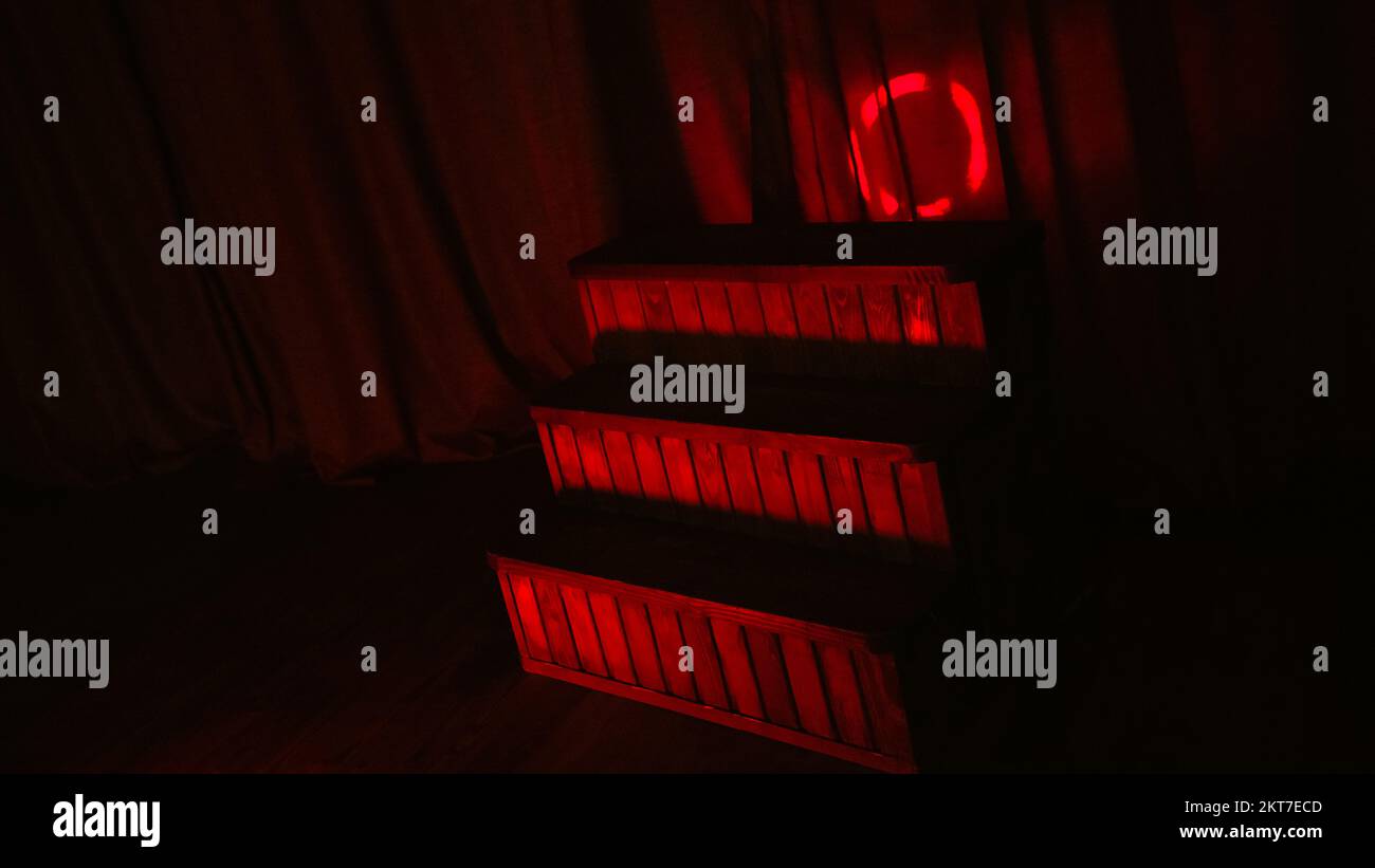 Red night LED lighting wooden stairs on the stage of theatre and red ...