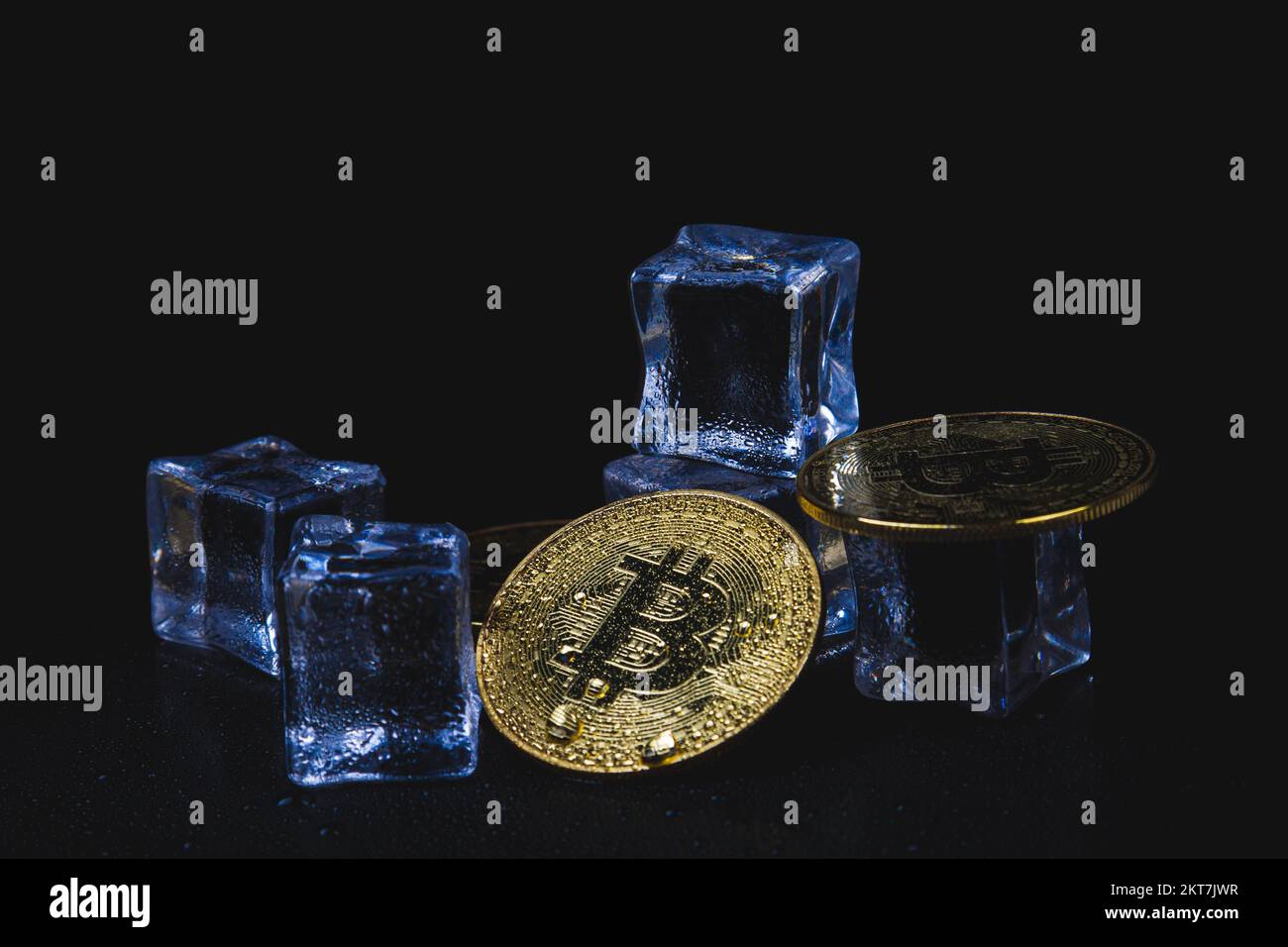 Ice and bitcoin coin. Freezing of cryptocurrency accounts. Frozen ...