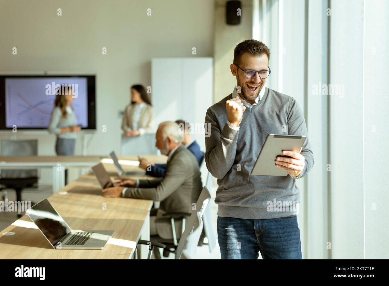 Financial team using digital tablet hi-res stock photography and images ...