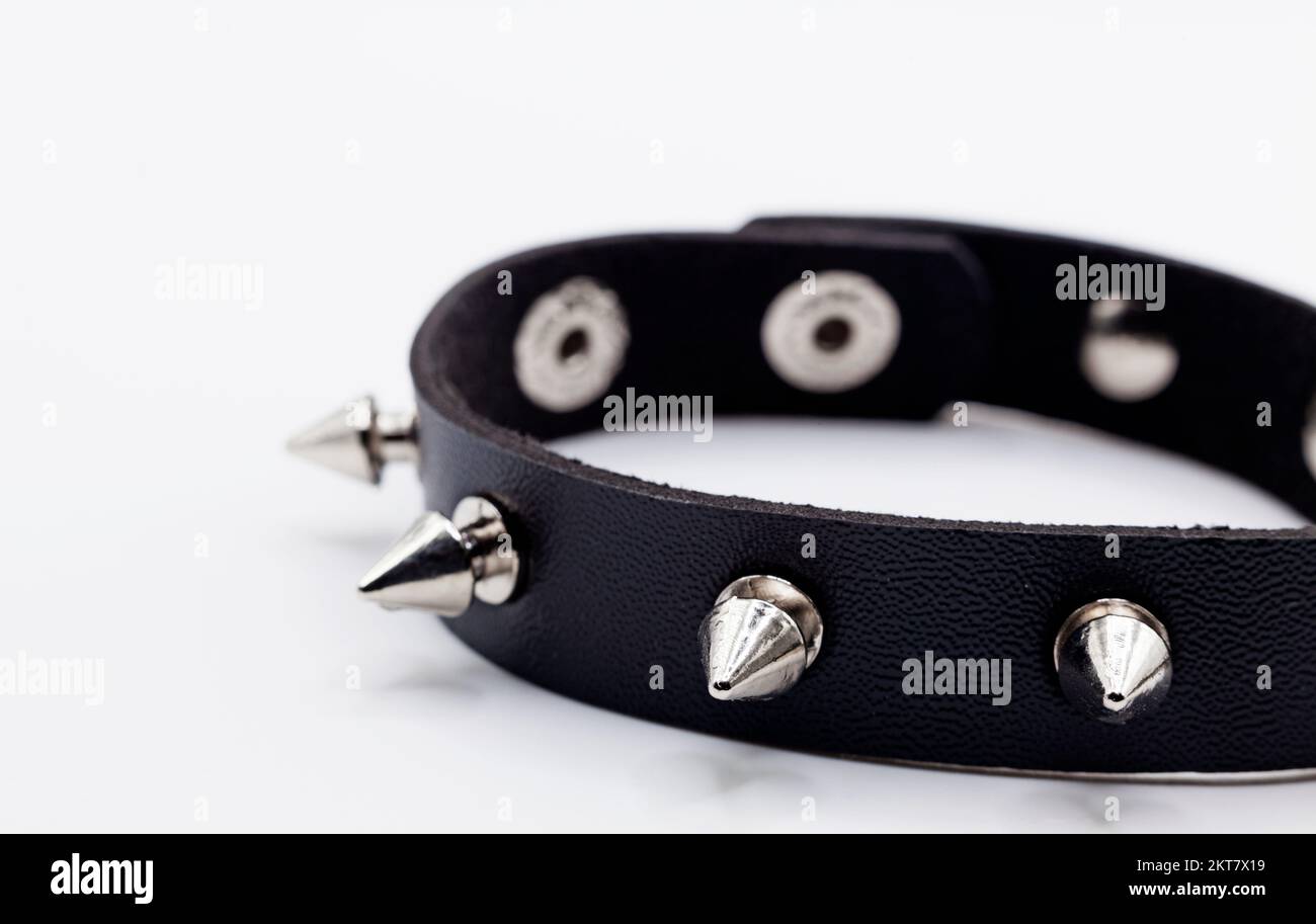 rivet bracelet with black leather on white background Stock Photo - Alamy