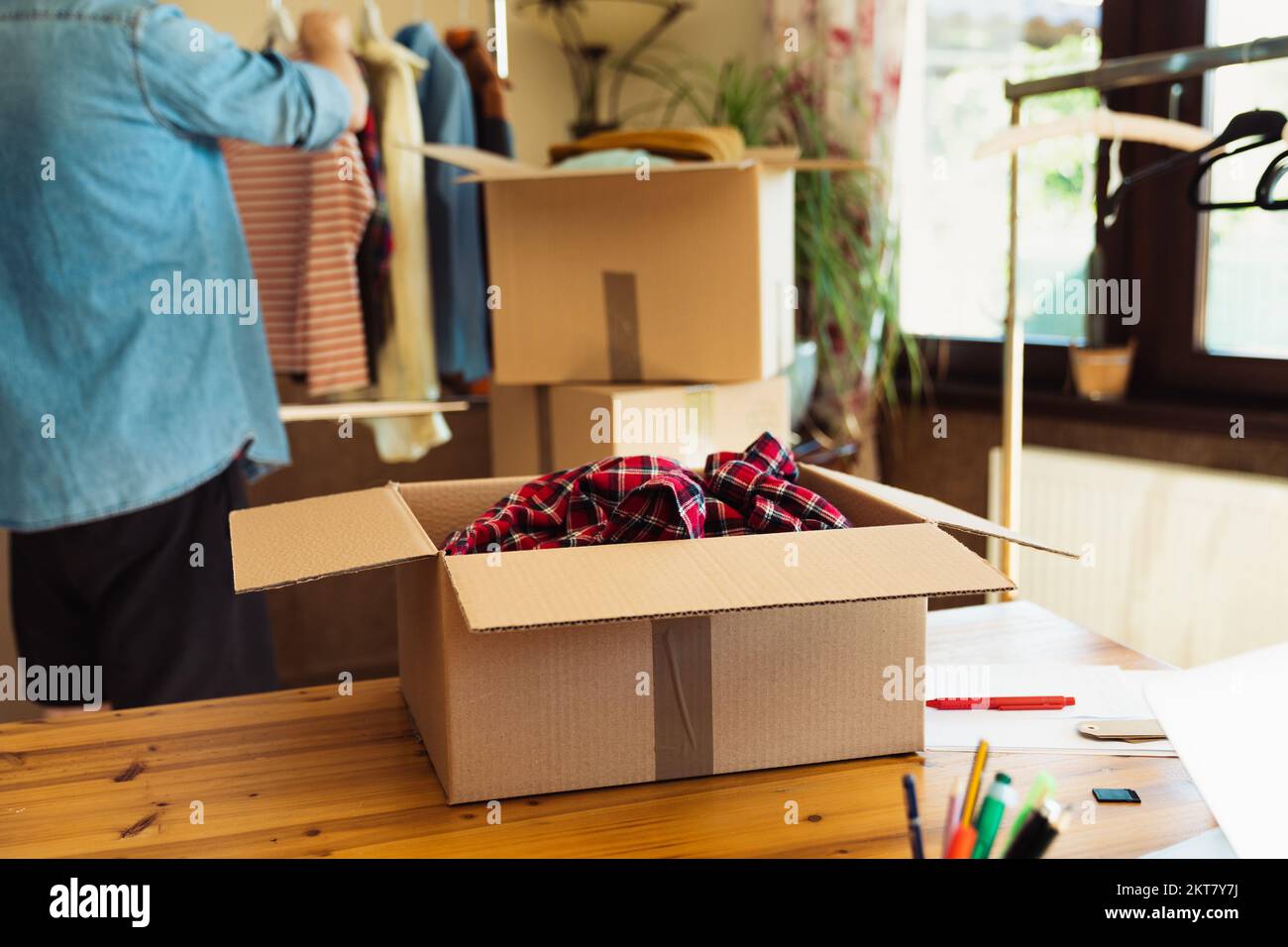 Pre owned clothes resale or donation Stock Photo - Alamy