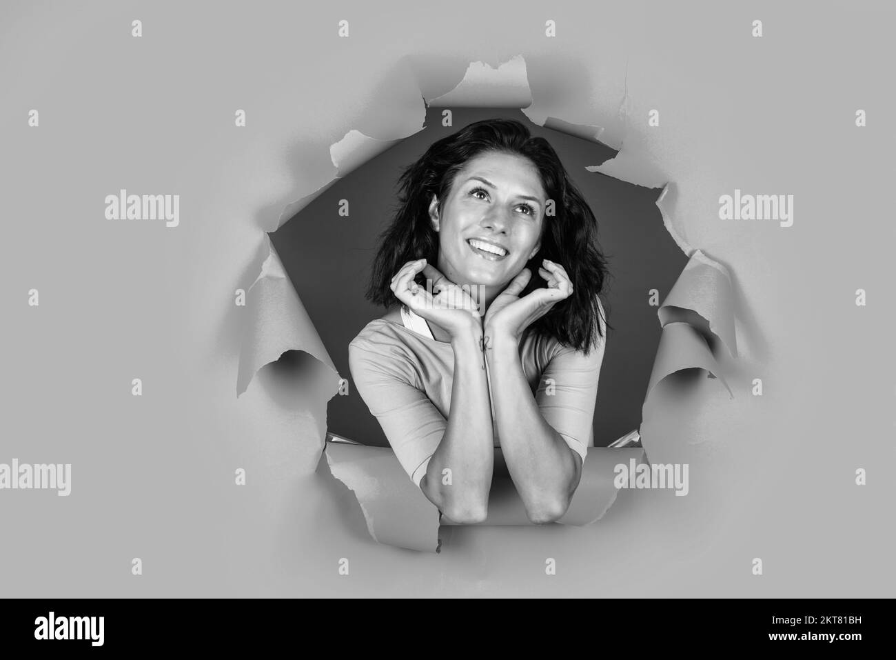 happy pretty woman with brunette hair on blue background, happiness ...