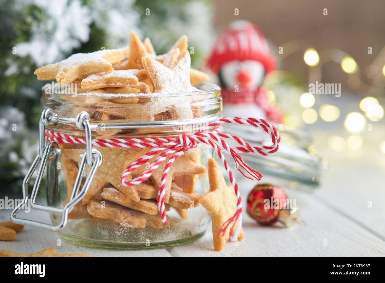 Christmas shortbread cookies or gingerbread stars with red ribbon ...
