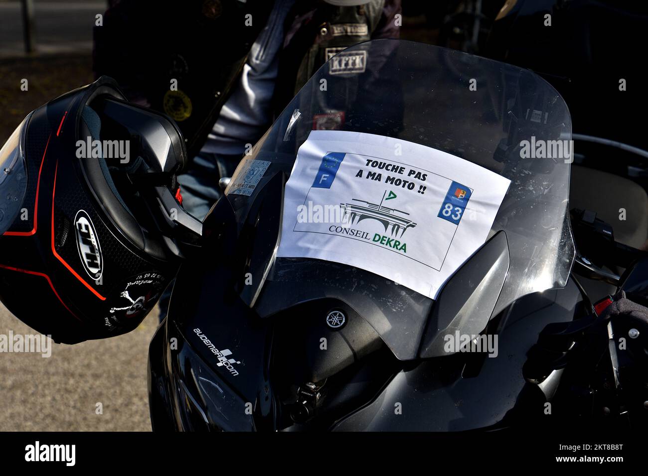 A placard is stuck on the windshield of a motorcycle during the ...