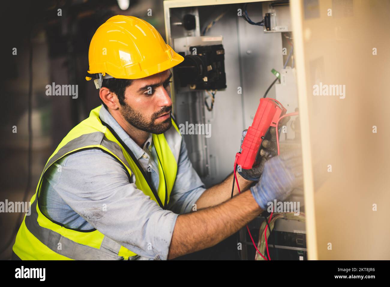 Electrical engineer work tester measuring voltage and current of power ...