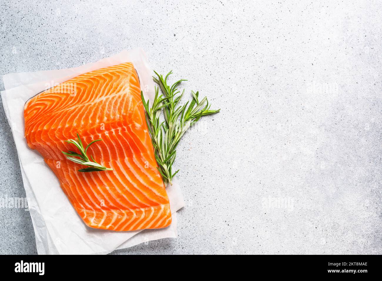 Raw salmon, fresh fish fillet at white background Stock Photo - Alamy