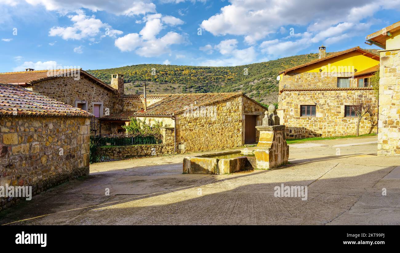 Source of fresh mountain water in the square of the old stone village ...