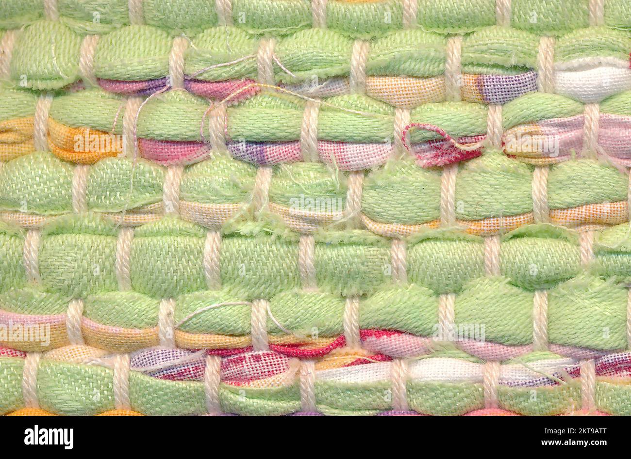 Closeup of handwoven rug rug in warm and bright pastel colors, plain ...