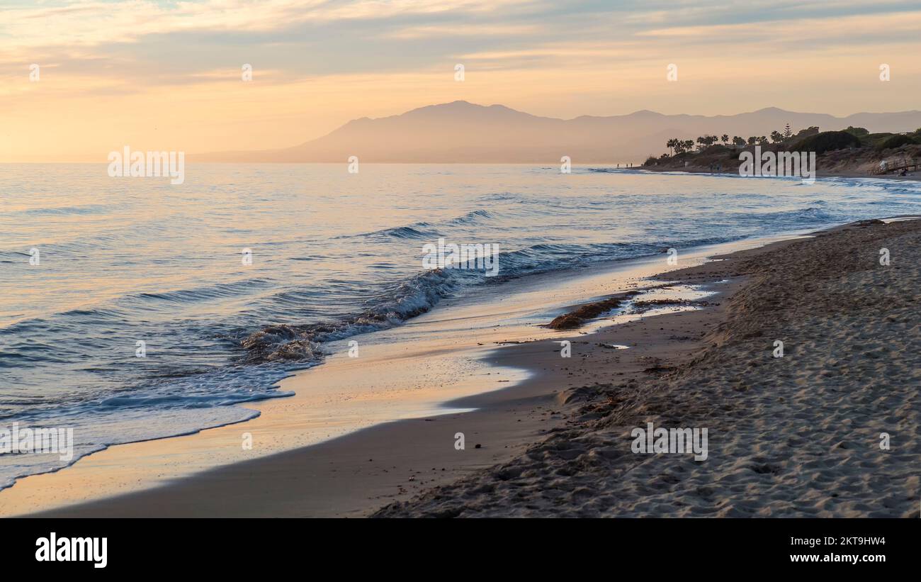 Sunset with clouds on the beaches of Marbella Stock Photo - Alamy