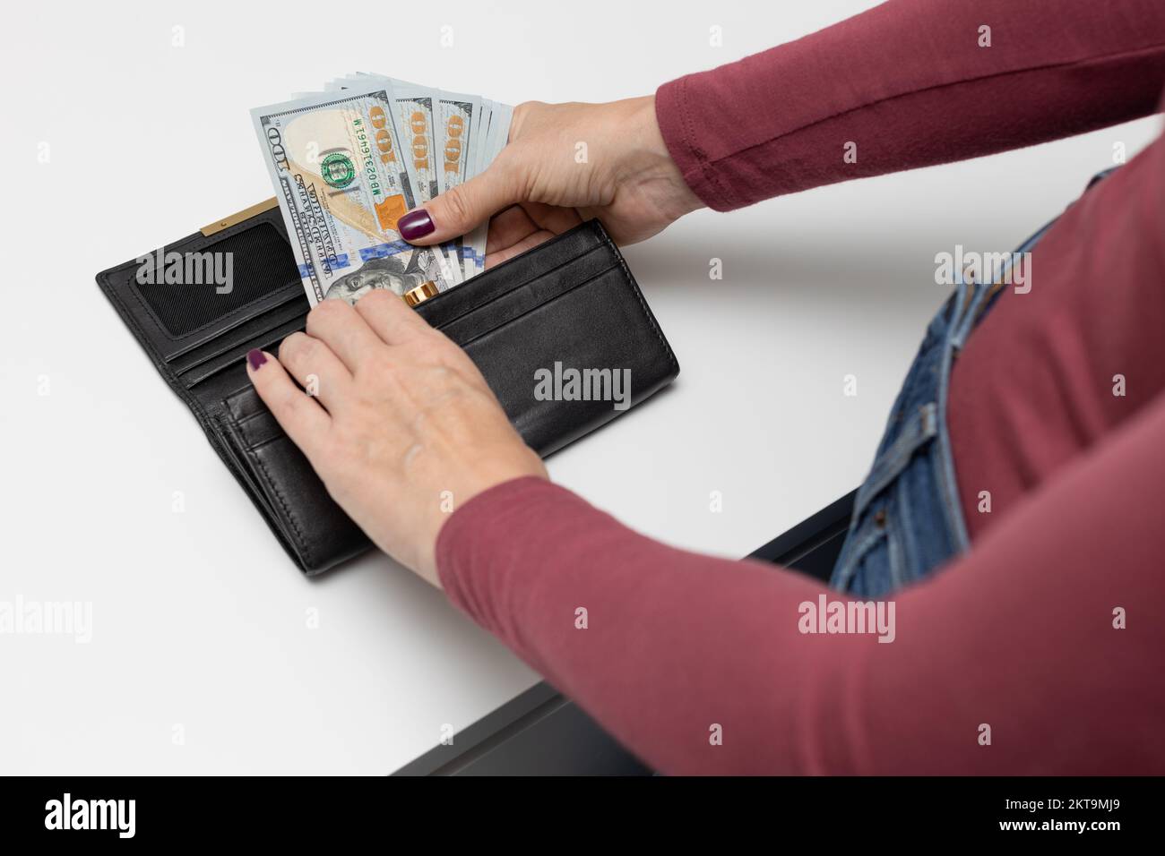 man takes out dollars from his wallet. woman taking money out of wallet ...