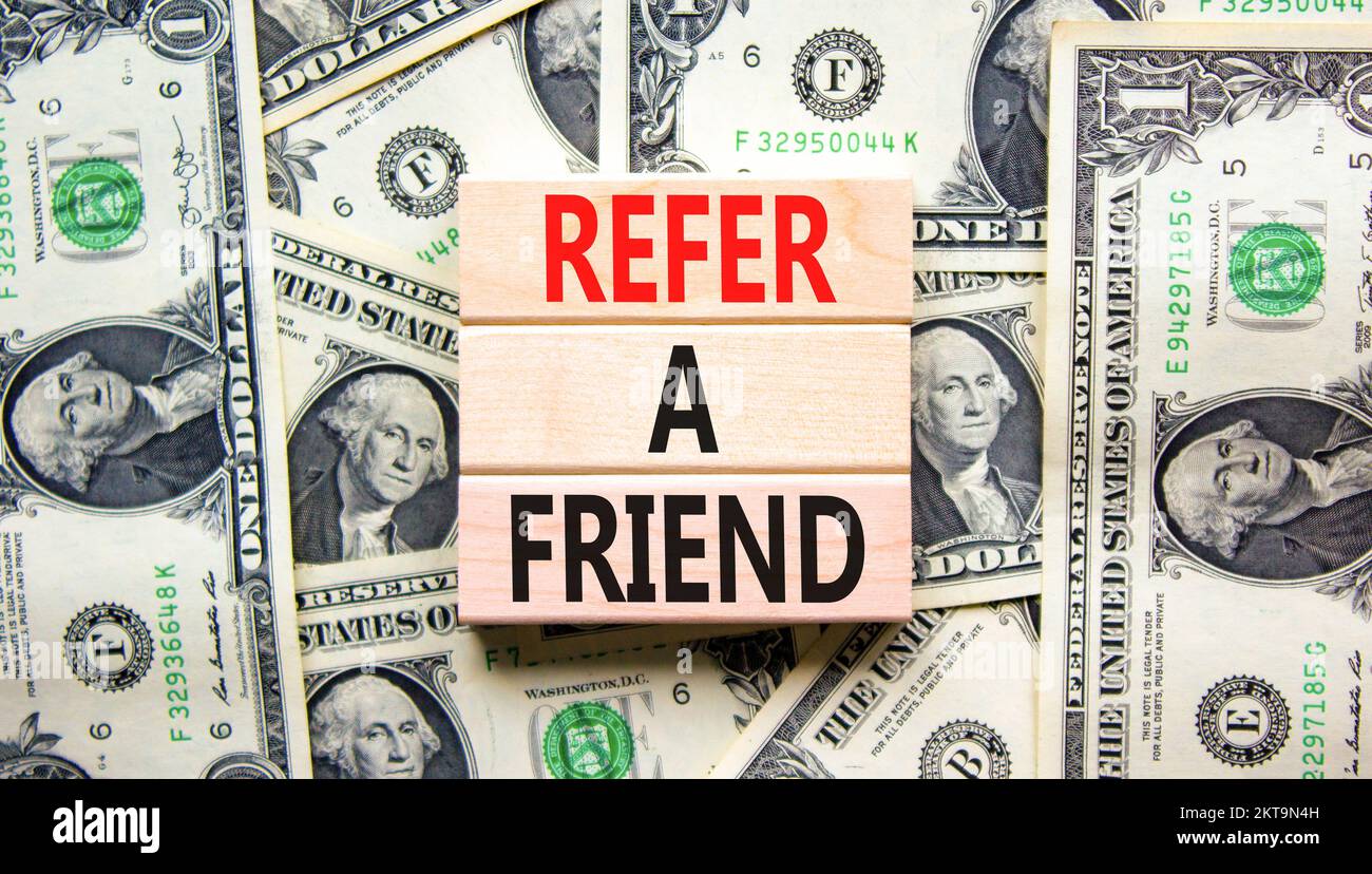 Refer a friend symbol. Concept words Refer a friend on wooden blocks on ...