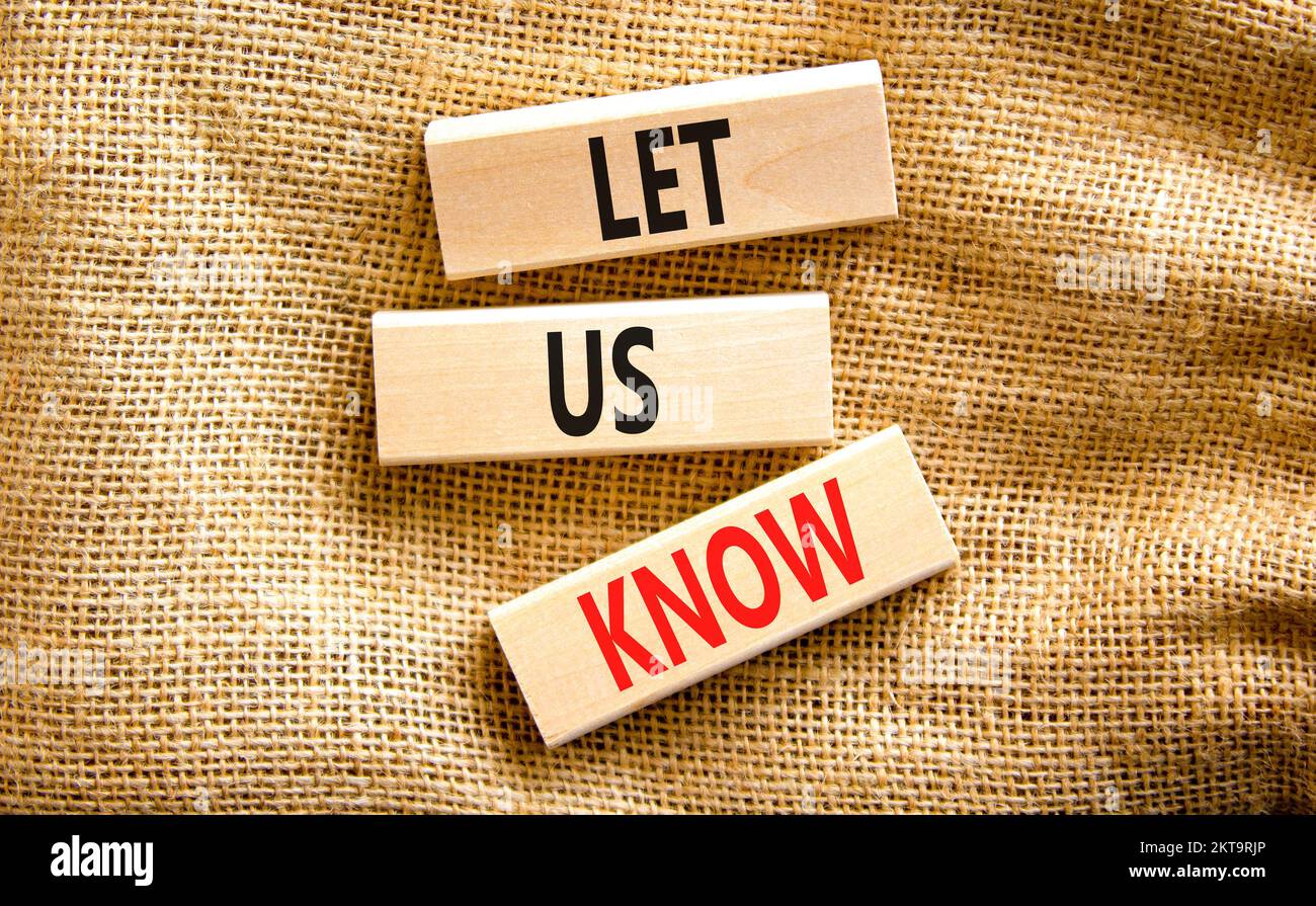Let us know symbol. Concept words Let us know on wooden blocks on a ...