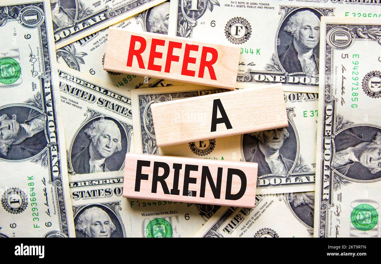 Refer a friend symbol. Concept words Refer a friend on wooden blocks on ...