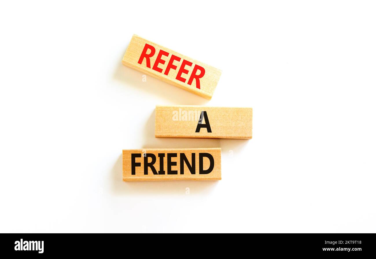 Refer a friend symbol. Concept words Refer a friend on wooden blocks on ...