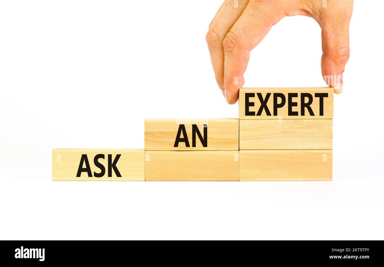 Ask an expert symbol. Concept words Ask an expert on wooden blocks on a ...