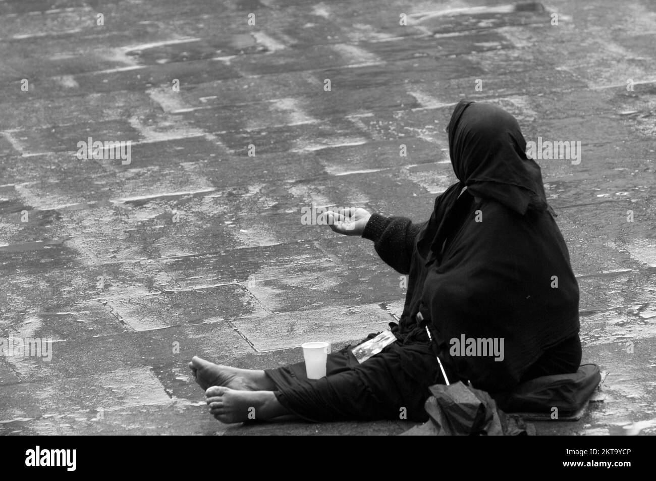 Old woman begging Black and White Stock Photos & Images - Alamy