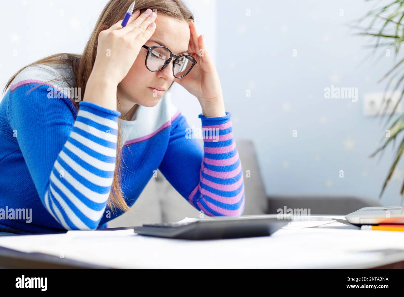 Woman manage household finances frustrated with family financial ...