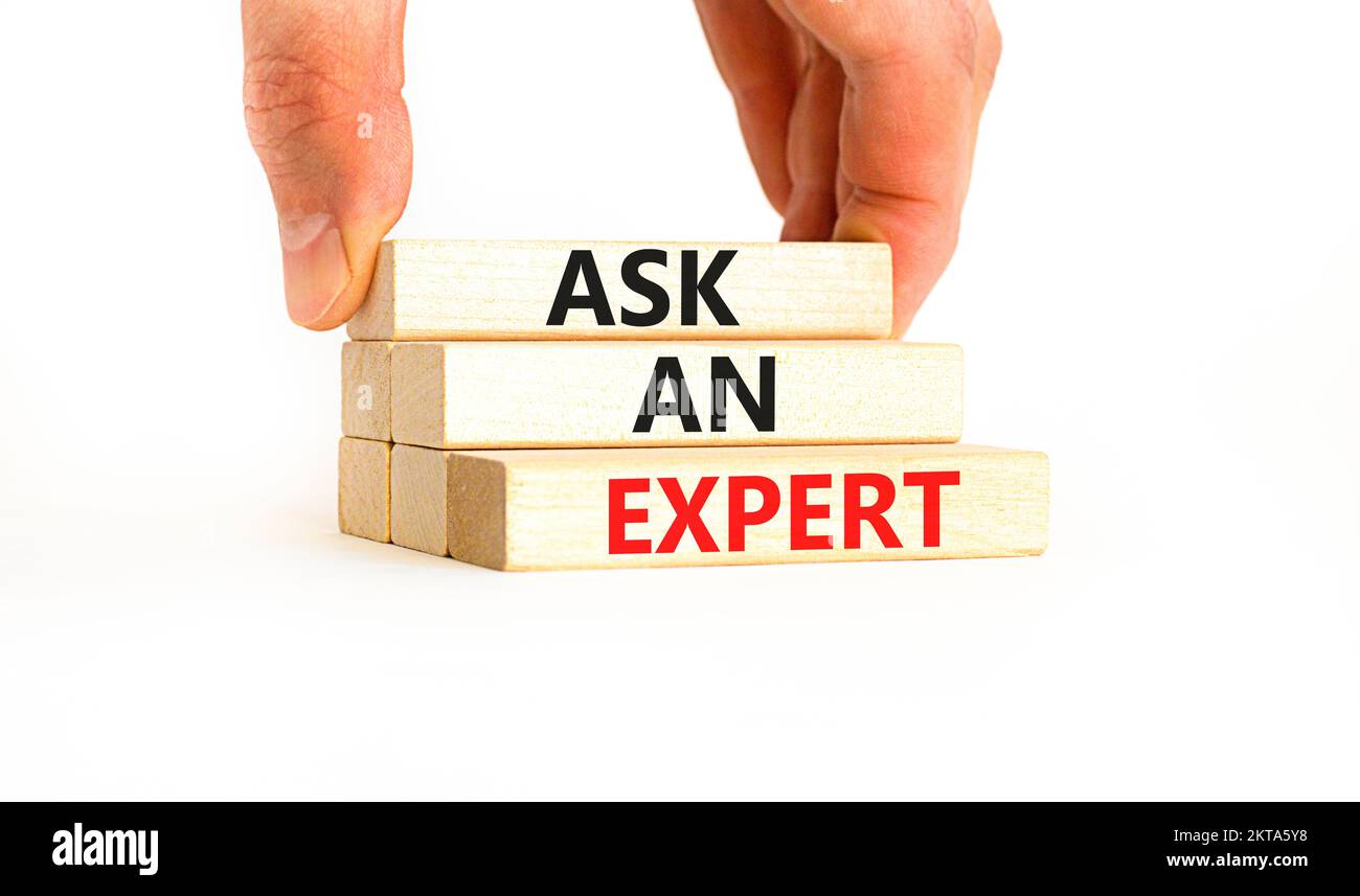 Ask an expert symbol. Concept words Ask an expert on wooden blocks on a ...
