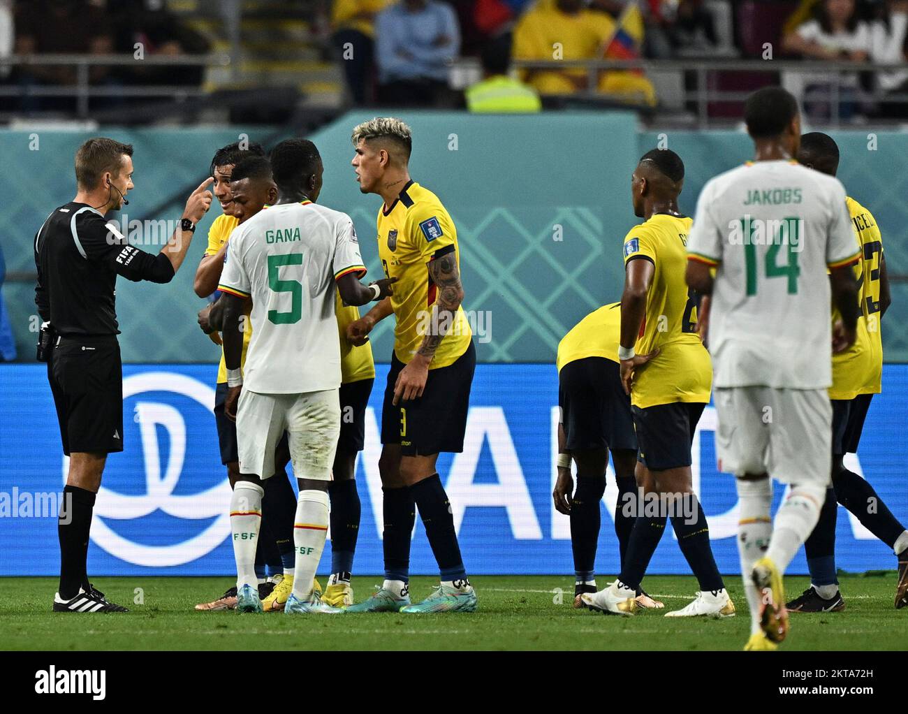 Doha, Qatar. 29th Nov, 2022. Referee Clement Turpin (1st L) gestures ...