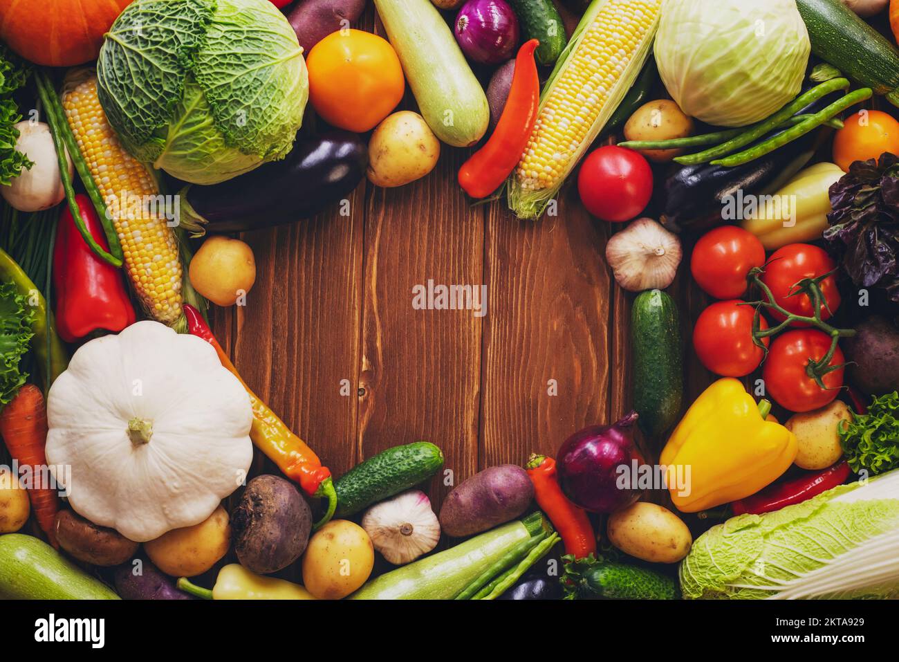 Healthy food background Assortment of fresh vegetables on wooden ...