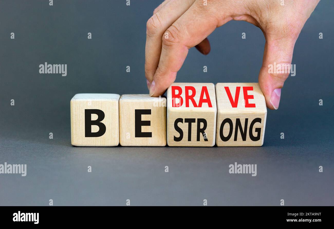 Be strong and brave symbol. Concept word Be strong Be brave on wooden ...